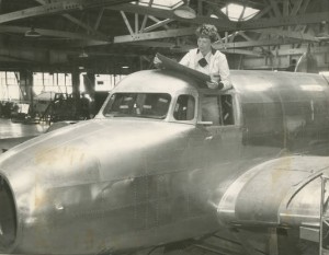 Amelia Earhart standing in the cockpit of of the Lockheed Electra 10E ...